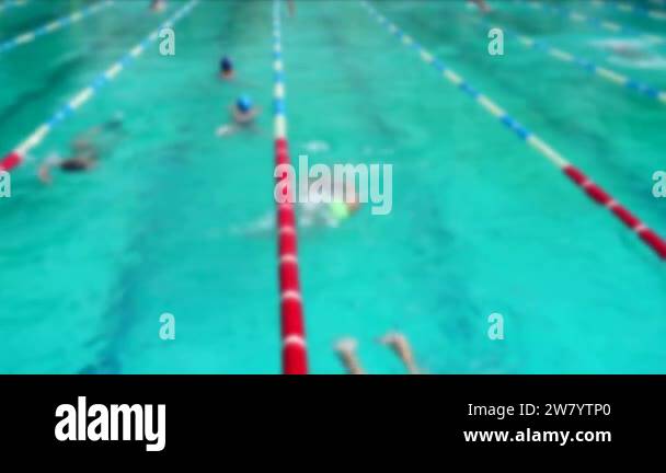 Swimming pool training. Athletes practice swimming technique. Out of ...