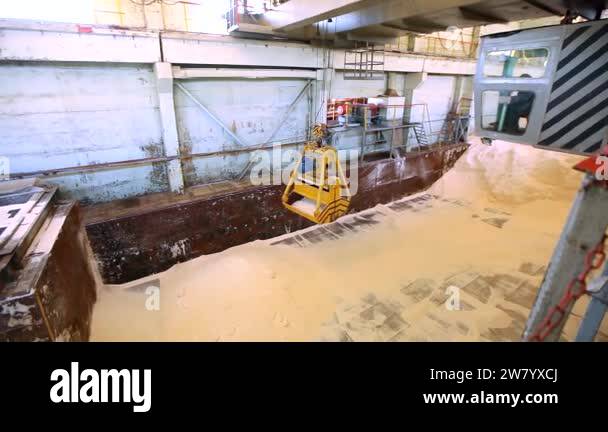 The girder crane loads fertilizer. A girder crane in a warehouse is ...