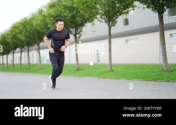 young asian runner athlete with muscle pain. Man massaging Stretching ...