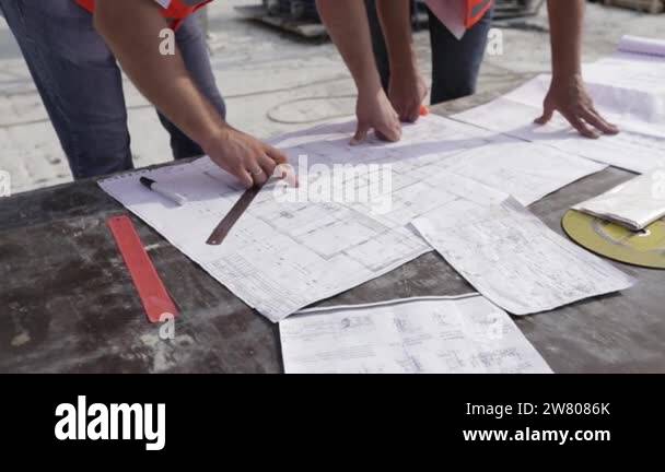 Concentrated professional male engineer drawing outlay of final ...