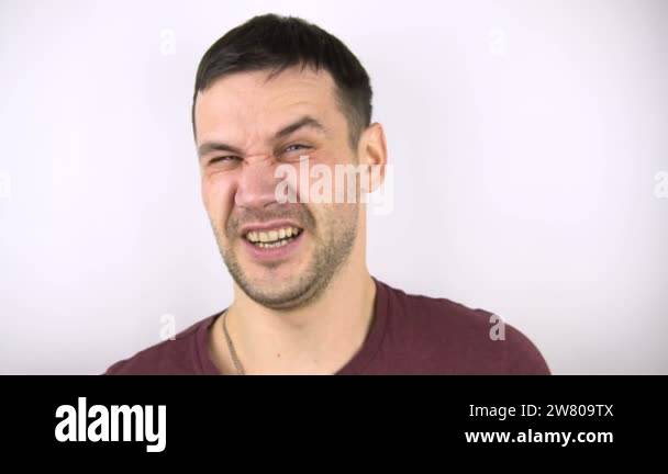 Slow motion of a blow to the cheek with the palm of the hand. A young ...