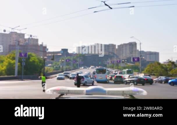 Traffic control police officers on duty show signs for cars on junction ...
