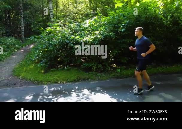 Athlete runs around park Stock Videos & Footage - HD and 4K Video Clips ...