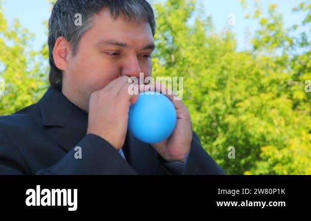 Man blowing up balloon Stock Videos & Footage - HD and 4K Video Clips ...