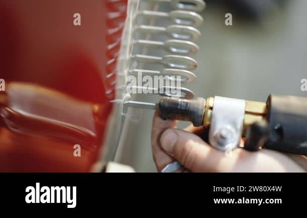 Car body repair welding and restoration. Man welding a part of the car ...