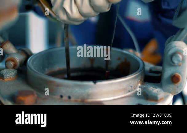 Oil sampling from oil storage for quality control Stock Video Footage ...