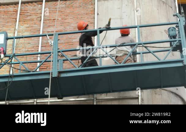 Industrial worker welding of metal structures, welder man male worker ...