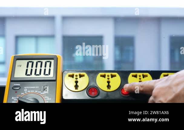 Measure the AC voltage of 230 Volts from the power outlet with a ...