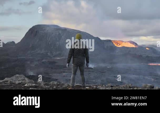 Man Watching Lava Flow From Erupting Fagradalsfjall Volcano Stock Video ...
