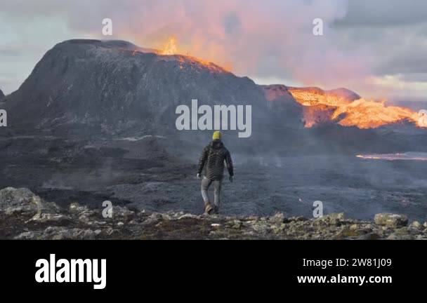 Man Watching Lava Erupting From Fagradalsfjall Volcano In Iceland Stock ...