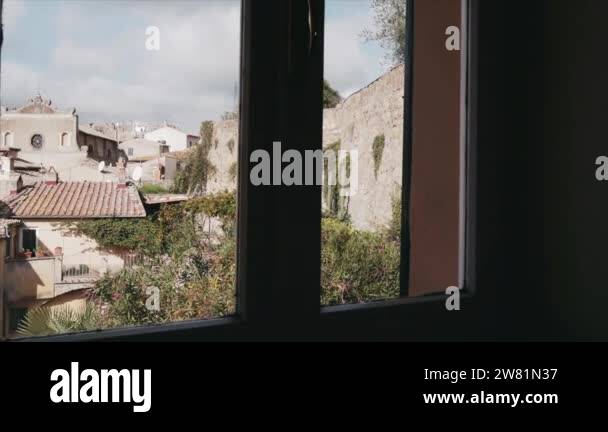 View through the window of amazing ancient Italian village buildings ...