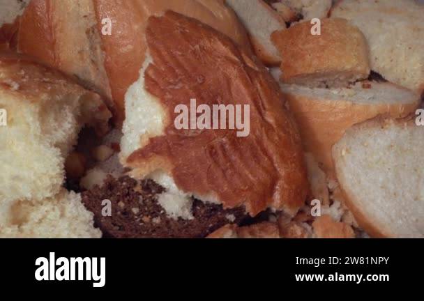 Many slices of stale bread. Dry bread thrown in the trash. Discarded ...