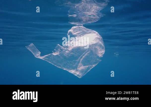 garbage in the sea. Plastic pollution of the sea. used, transparent ...