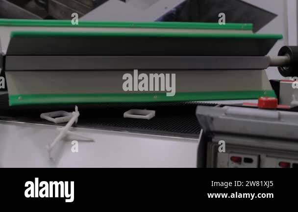 Automatic sorting conveyor system - moving plastic details on conveyor ...