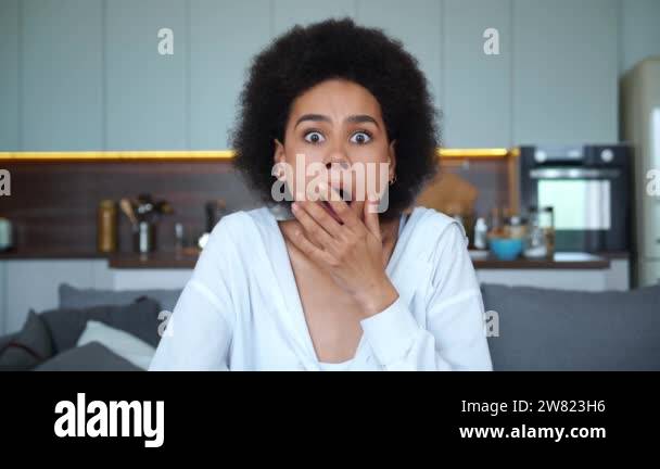 Close-up portrait. Young African American woman looking directly into ...