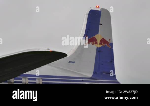 Red Bull energy drink logon in the huge tail of a historic plane Stock ...