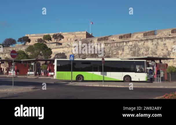 Valletta, Malta Public Transport Bus parked at terminal. Green & white ...