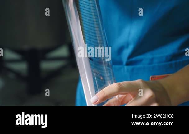 Scientist pouring wine product liquid into test tube, Quality control ...