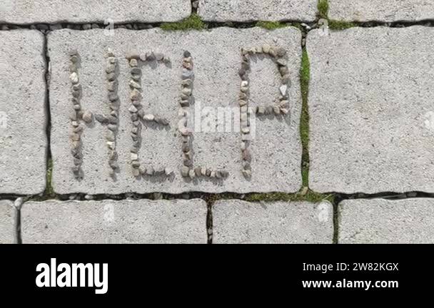 Inscription help. No help needed. Despair Stock Video Footage - Alamy