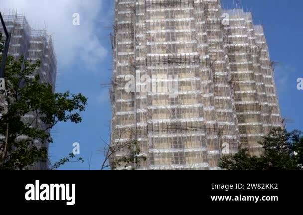 Tall high rise building in Hong Kong construction with whole bamboo ...