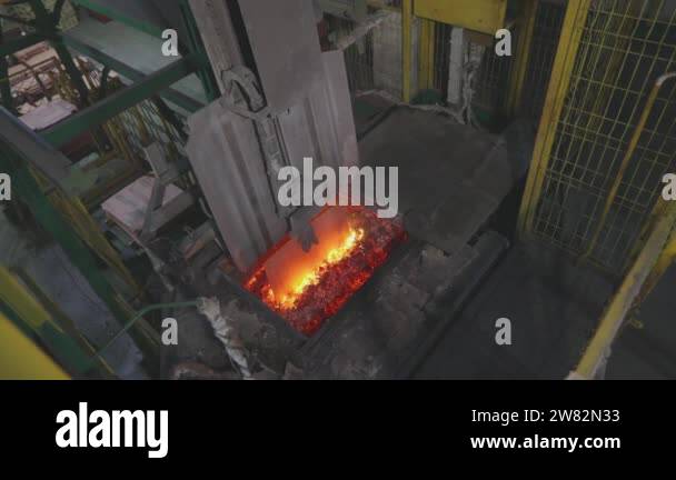 The process of melting copper in the furnace. The furnace with molten ...