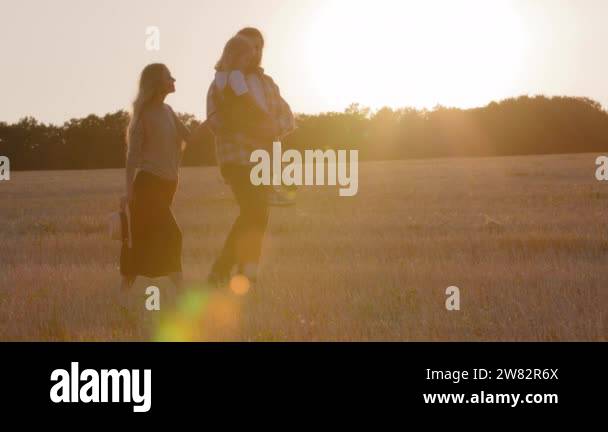 Holidays weekend outdoors in nature three silhouettes farmers on ...