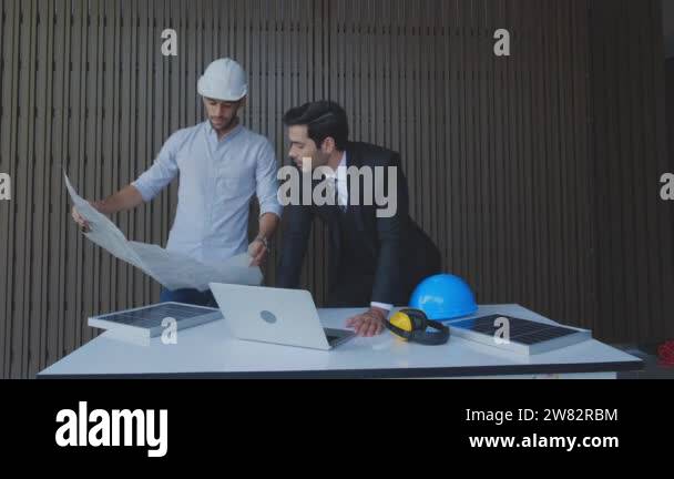 Team engineer talking and planning about install electric with panel of ...