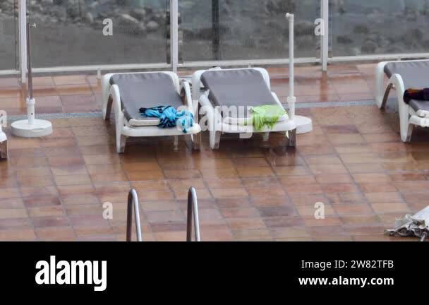 Extremely rainy wether at a holiday resort showing the rain pouring ...