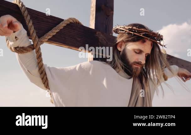 Jesus crucified on the cross, the wind is blowing. Crown of thorns ...