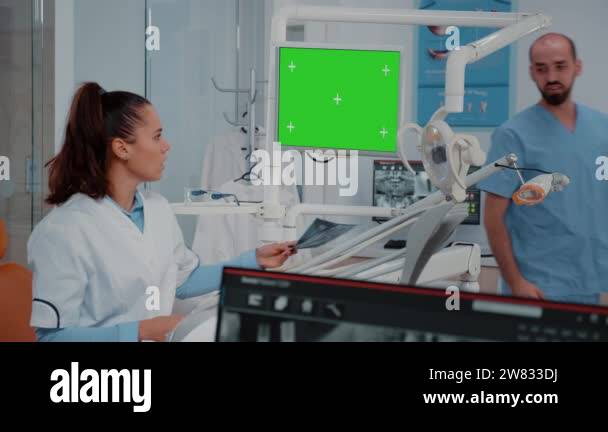 Woman analyzing green screen on monitor and teeth x ray Stock Video ...