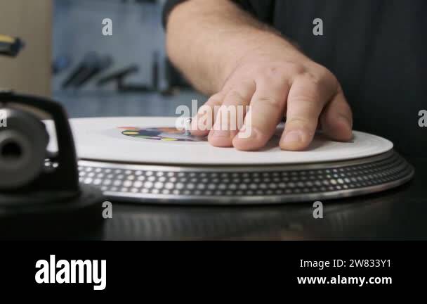 Hip hop dj scratches vinyl records on turntable in slow motion video ...