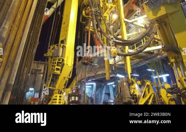 Drilling platform. Rig floor. Rotary table of rig. Top drive goes down ...