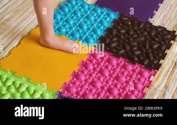 Children's preventive orthopedic massage mat made of puzzles with ...