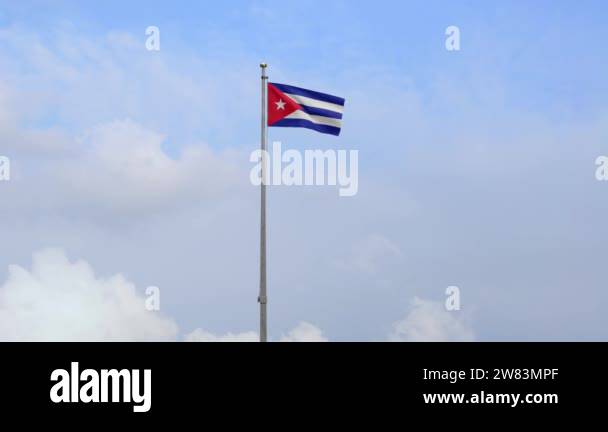 3D, Cuban flag waving on wind with blue sky and clouds. Cuba banner ...