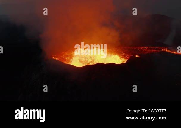 Fly around active volcano. Close-up of boiling molten magma in crater ...