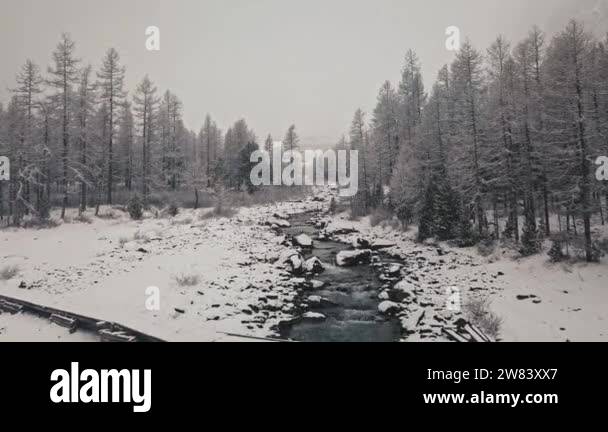 Storm, snowfall in the huge glacier of Mount Belukha, the valley of the ...