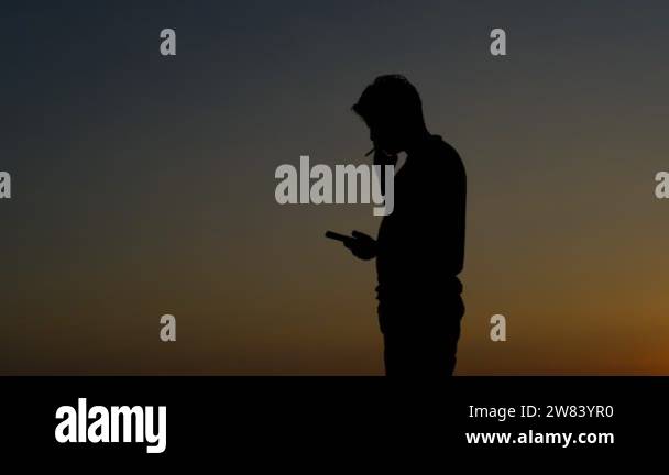 Silhouette phone man Stock Videos & Footage - HD and 4K Video Clips - Alamy
