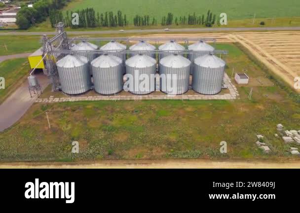 Grain storage elevator, Large metal hangar for grain. Silo with grain Stock Video Footage - Alamy