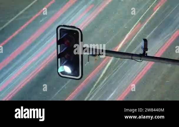 Traffic lights night lapse with car multi color trails. Illuminated ...