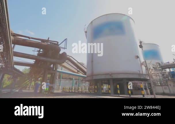 Large storage tanks in the factory. Exterior of a modern factory. White ...