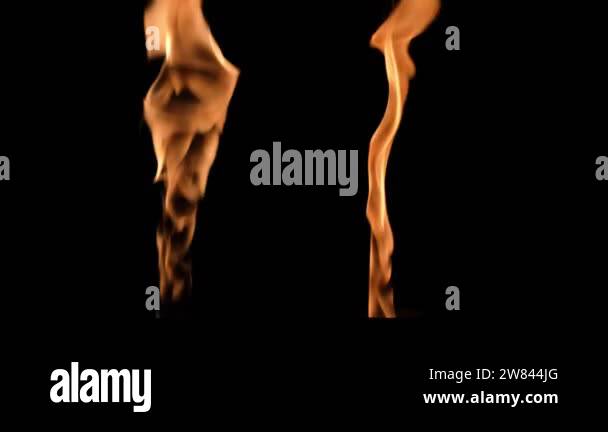 Two isolated fire flames, slow motion gas ignition from bottom to top ...