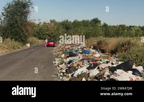 cars stop right on side of the road to dump their trash in spontaneous ...