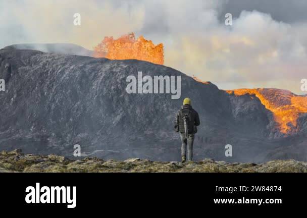 Man Walking Near Erupting Fagradalsfjall Volcano In Reykjanes Peninsula ...