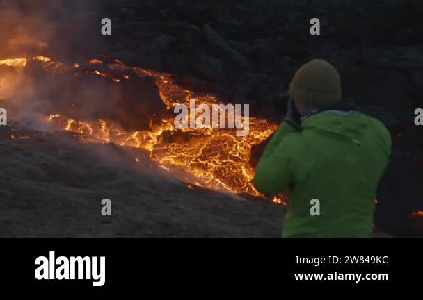 Man Photographing Lava Flow From Erupting Fagradalsfjall Volcano In ...