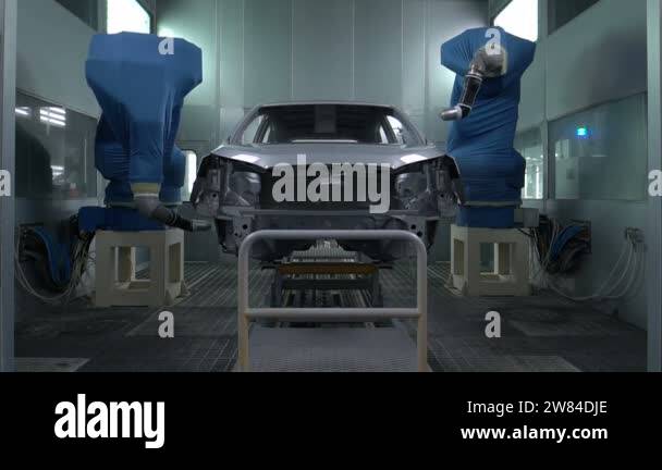 Industrial spray painting process. Auto robot painter sprays white ...