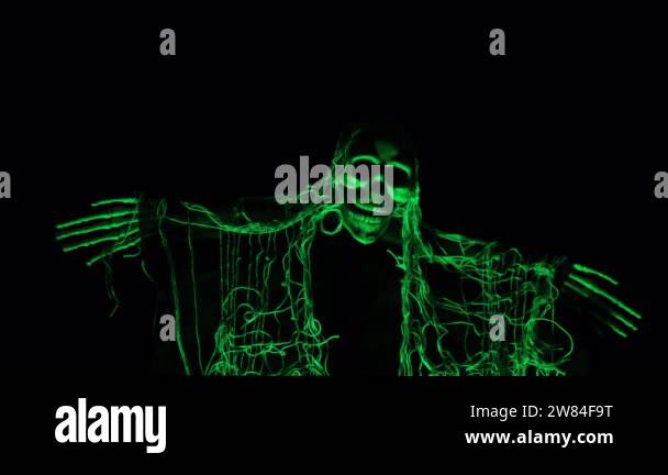 Halloween spooky skull with shocking green light. Skeleton appearing in ...