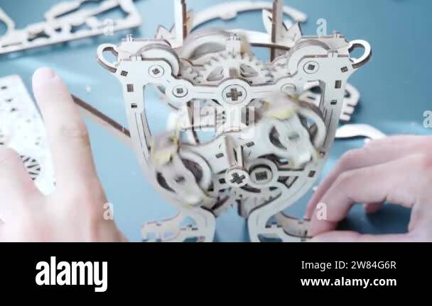 Working mechanism of mechanical wooden gear toy. Details of flywheels ...