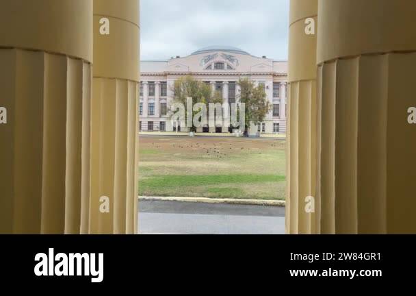 Facade of architectural building through columns. Historic house in ...
