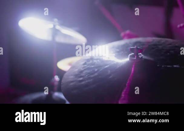Male Artist plays a drum kit. Night show in a musical instrument ...