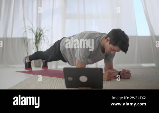Muscular Man Doing Fitness and Working Out on a Mat. Athlete With Lots ...